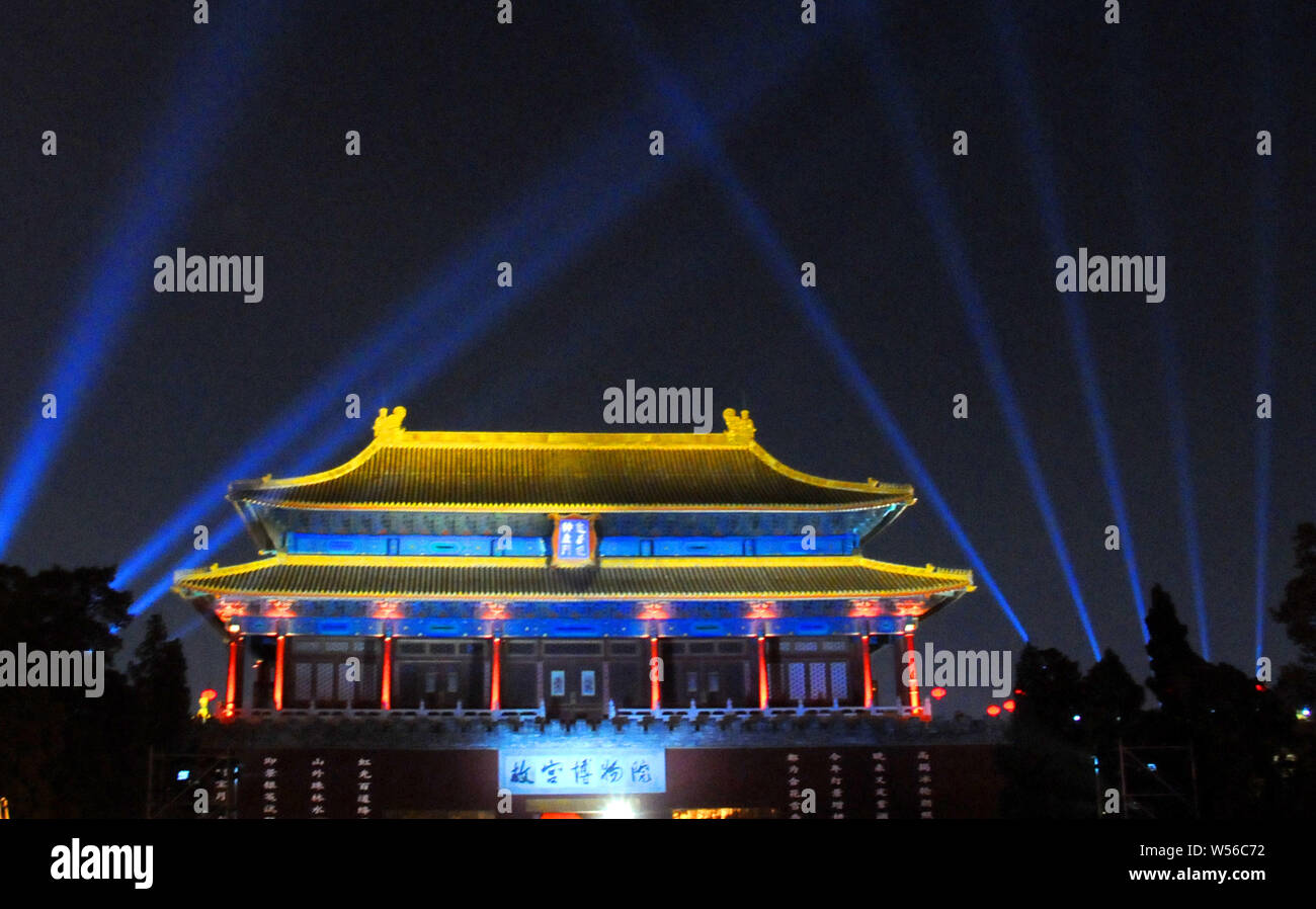 The Palace Museum, also known as the Forbidden City, is illuminated by ...