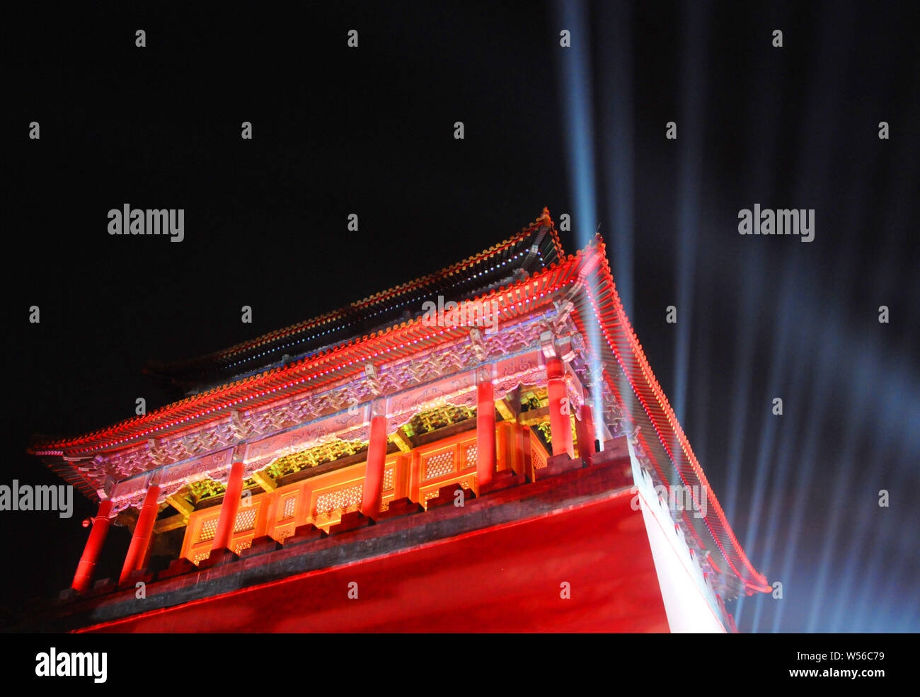 The Palace Museum, also known as the Forbidden City, is illuminated by colorful lights during a ...