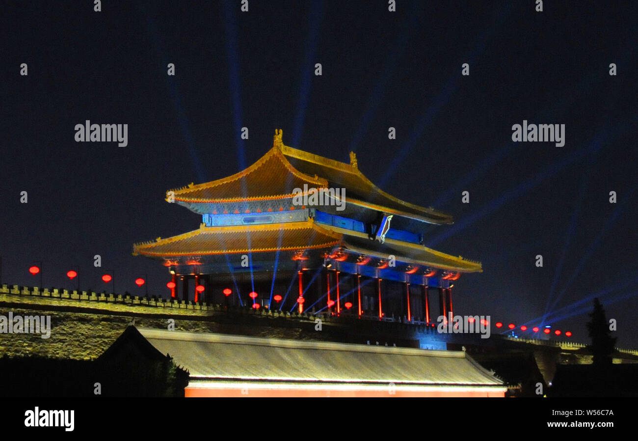 The Palace Museum, also known as the Forbidden City, is illuminated by ...