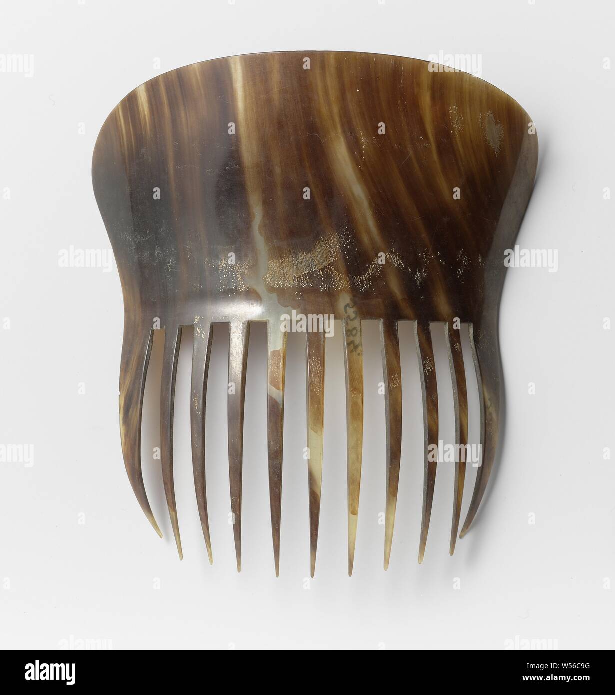 Hair comb of tortoise with unadorned curved back, 11 teeth., anonymous ...
