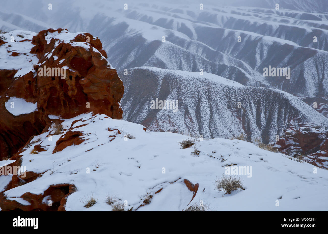 Landscape of the Danxia landform covered with snow during the Spring ...