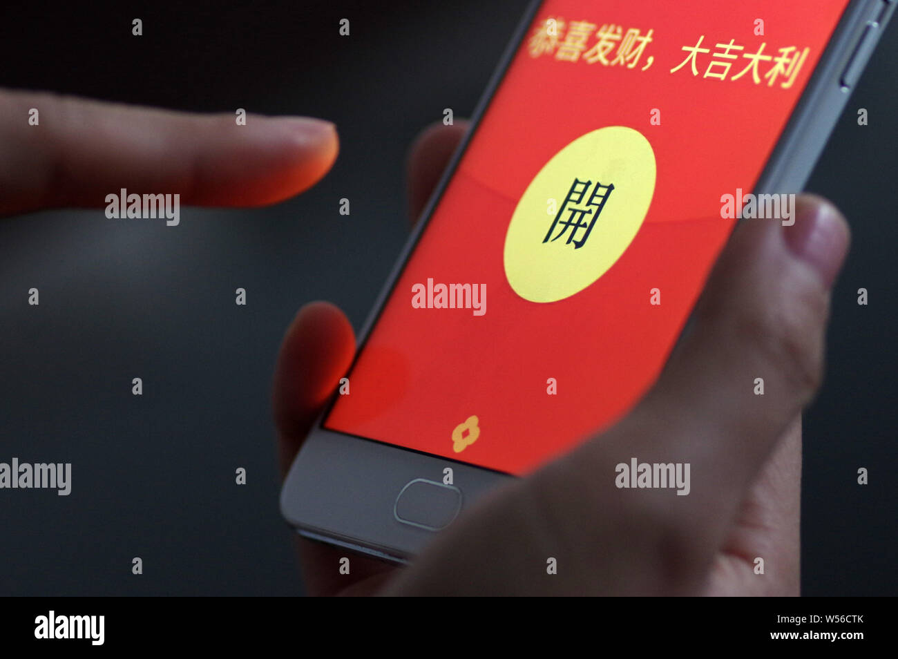 --FILE--A mobile phone user gets Hongbao (red envelope) by the mobile ...