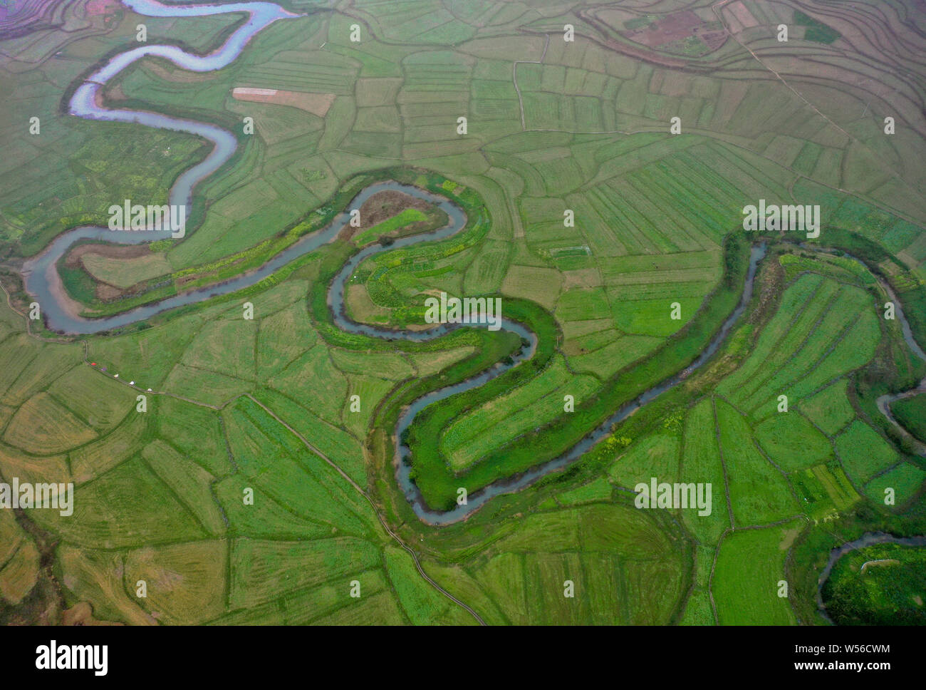 Aerial view of the Ming River, a symbol of Bama, flowing through the ...