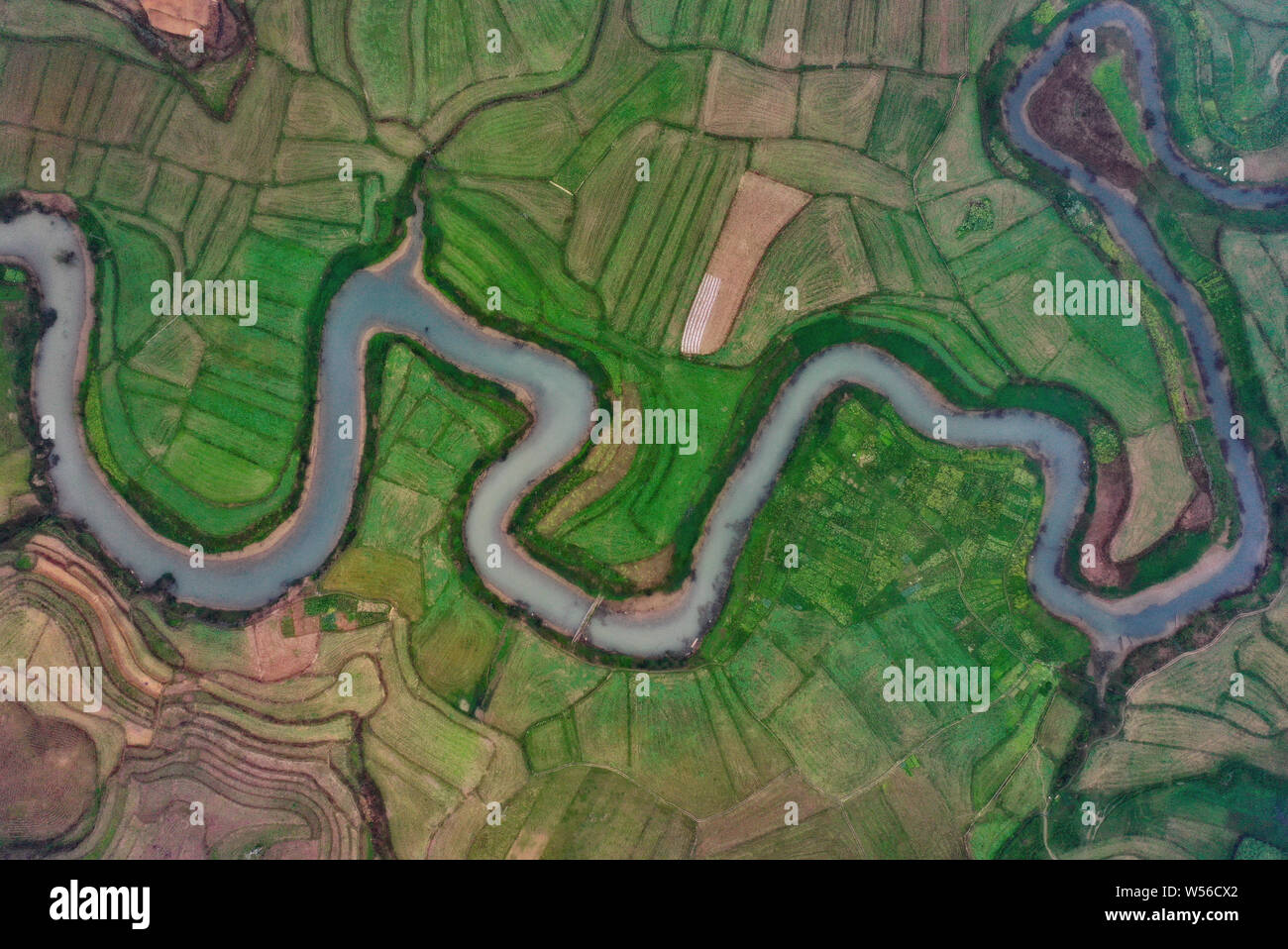 Aerial view of the Ming River, a symbol of Bama, flowing through the ...