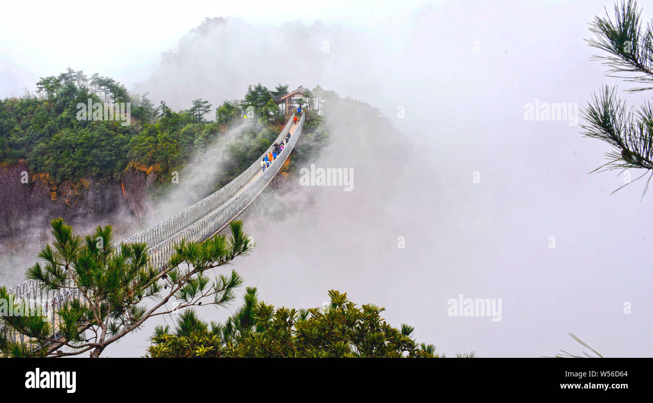 A view of seas of clouds floating through the Xianju National Park ...