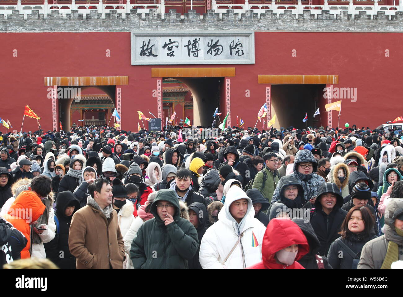 Tourists crowd the Palace Museum, also known as the Forbidden City ...