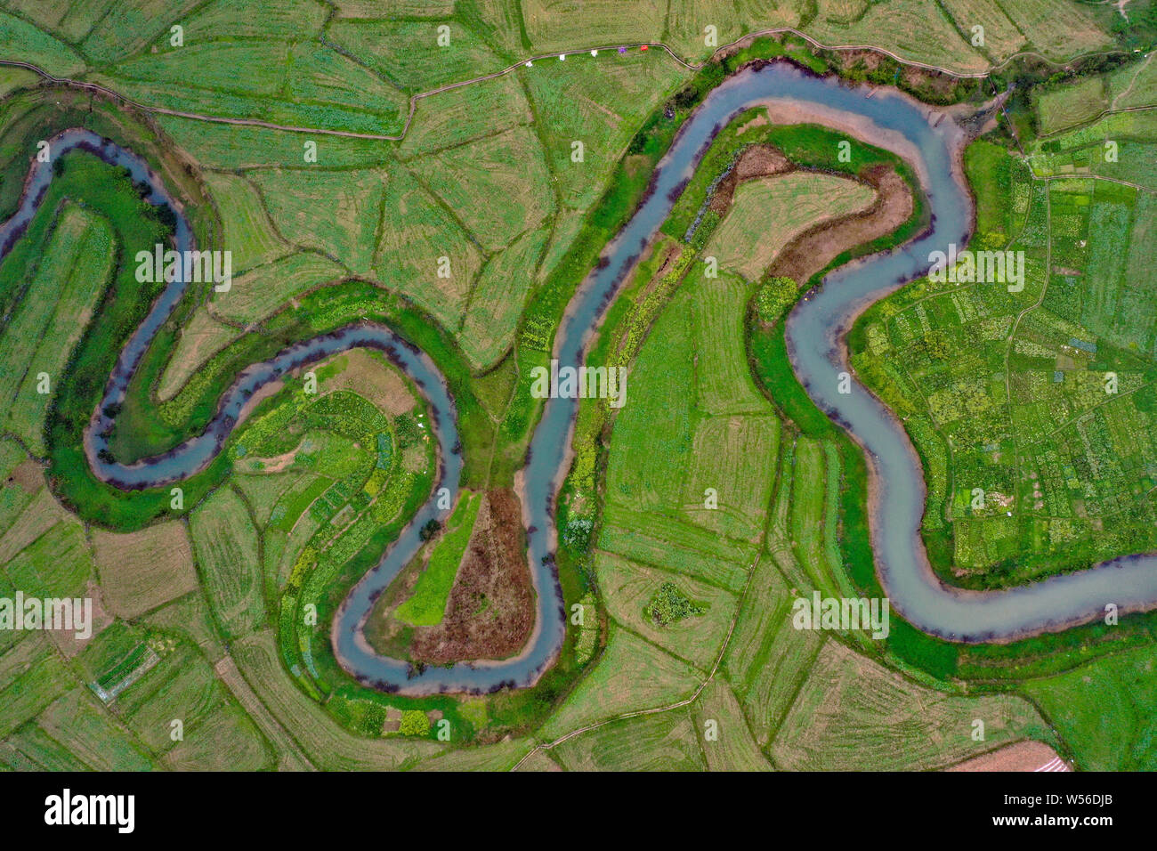 Aerial view of the Ming River, a symbol of Bama, flowing through the ...