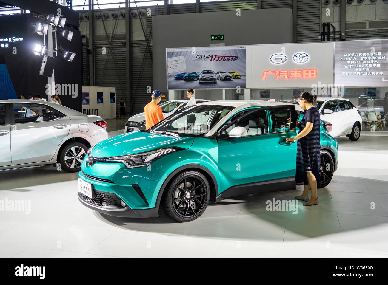 --FILE--People visit the stand of GAC-Toyota, a joint venture between ...