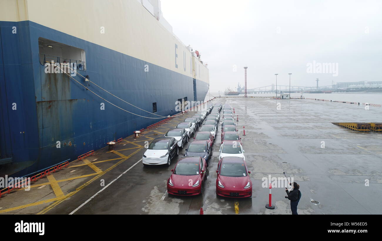 View of Tesla Model 3 electric vehicles parked at the Shanghai Haitong ...