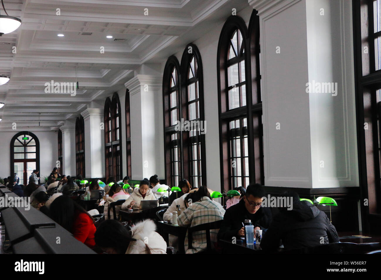 Students study in a reading room, decorated in a neoclassical style, in ...