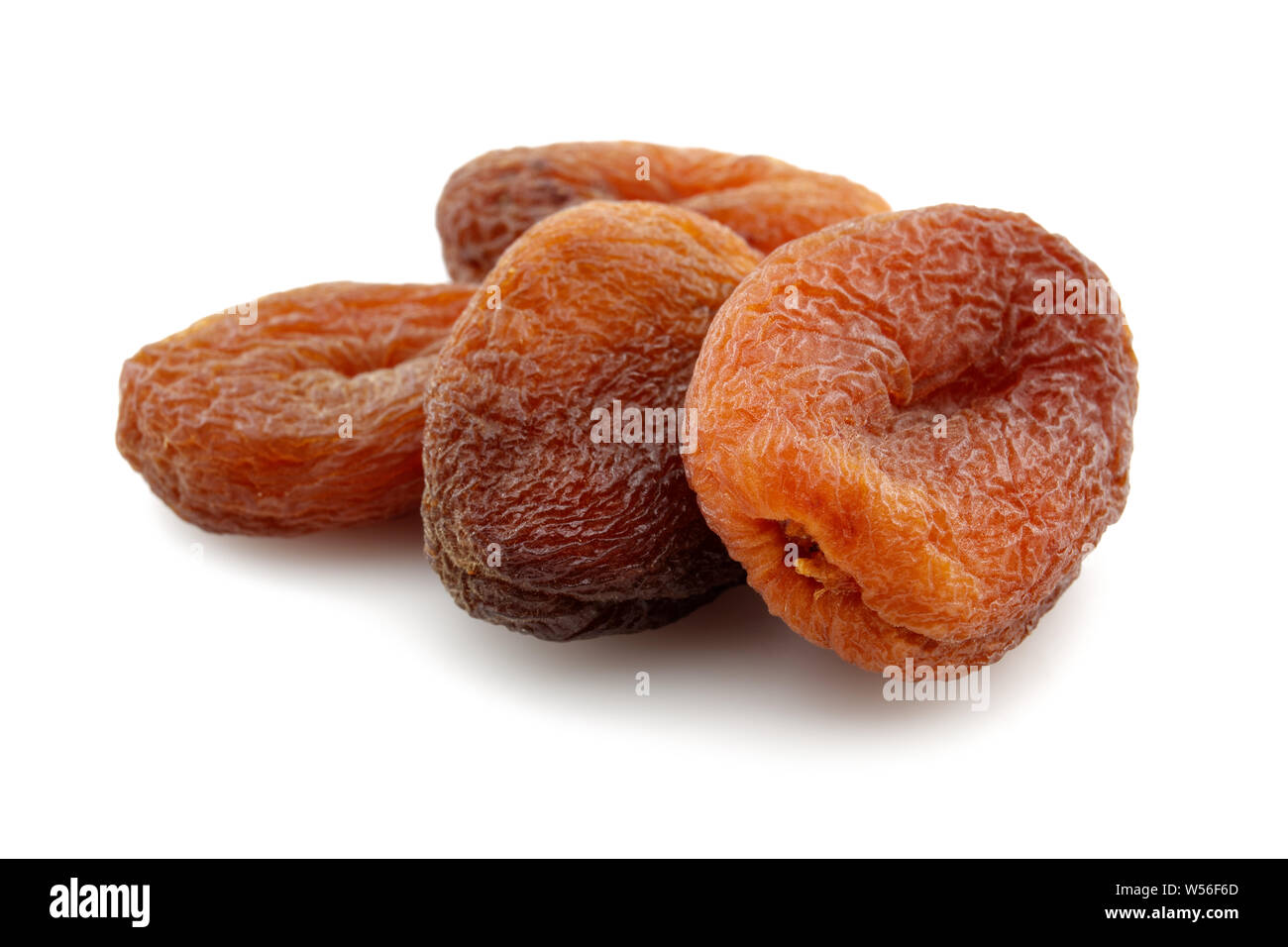 Organic dried apricots isolated on white background Stock Photo - Alamy