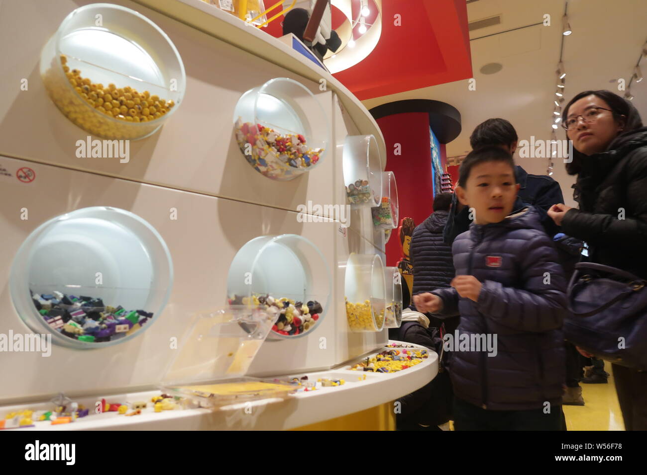 Customers shop in the first Beijing flagship store in the Wangfujing ...