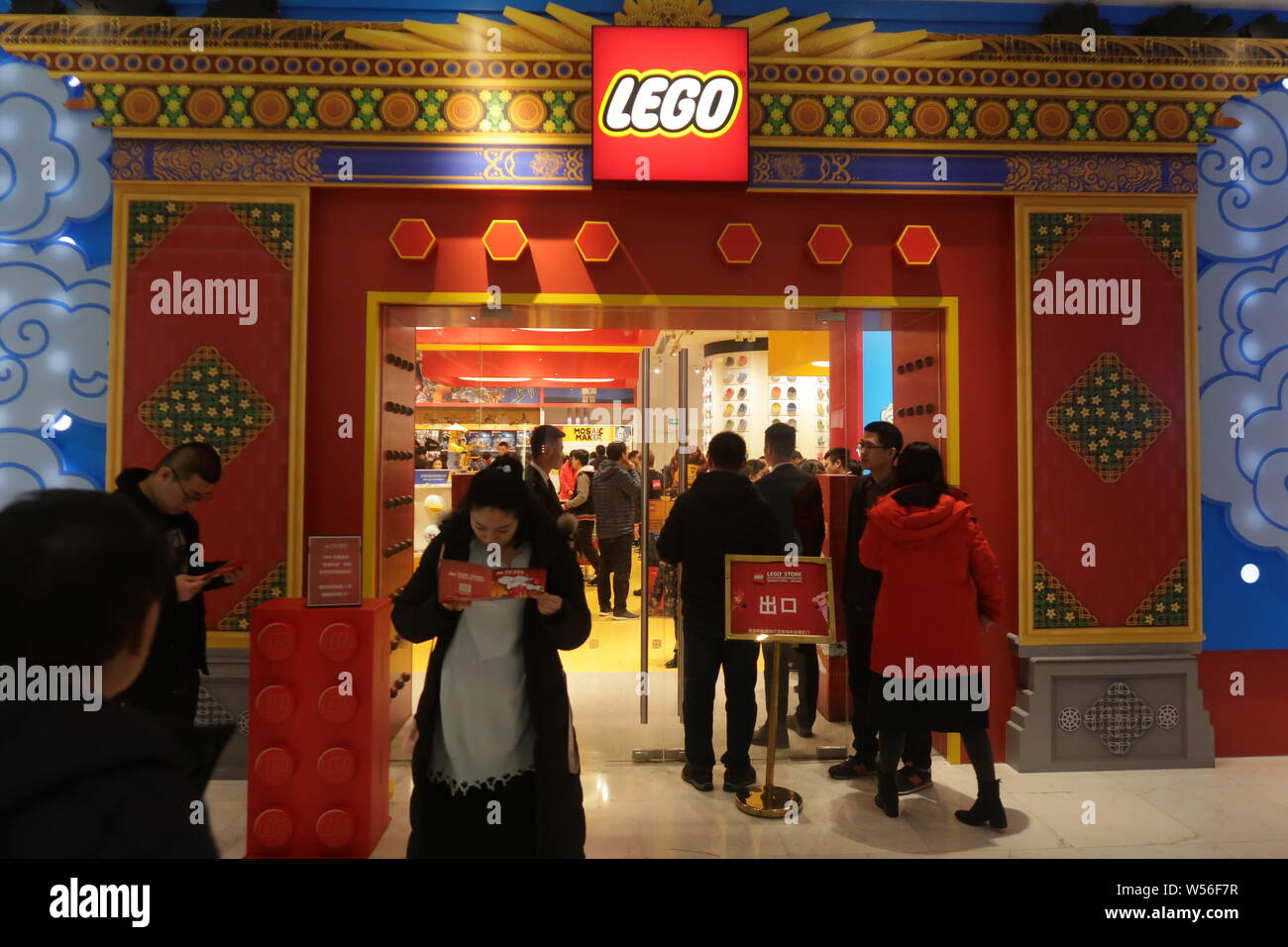 Customers shop in the first Beijing flagship store in the Wangfujing ...
