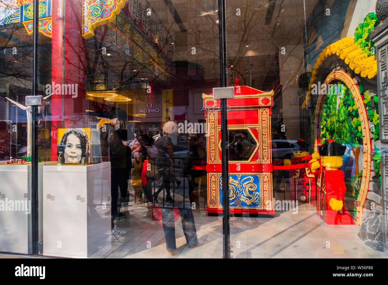 Customers shop in the first Beijing flagship store in the Wangfujing ...
