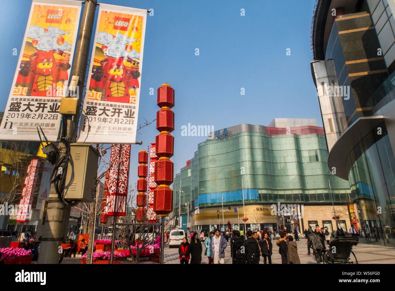 Pedestrians walk past the first Beijing flagship store in the ...