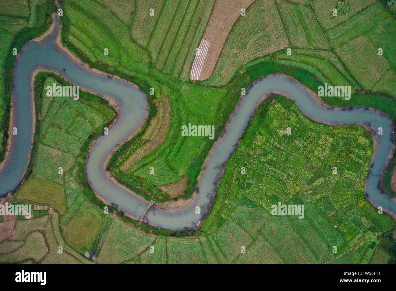 Aerial view of the Ming River, a symbol of Bama, flowing through the ...