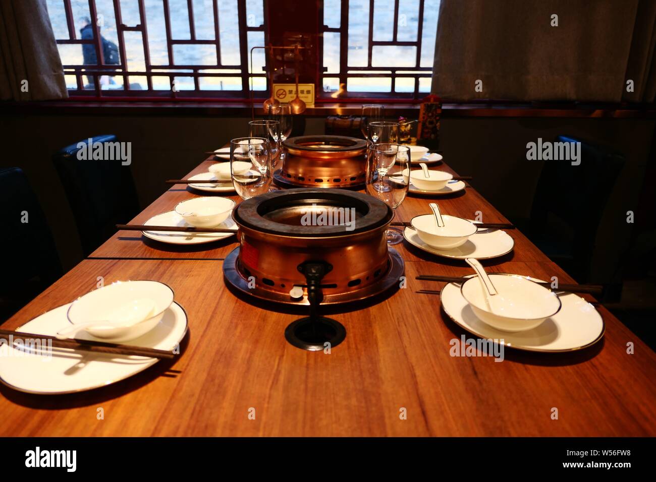 Hotpots are served at the emperor-themed hotpot eatery named Corner ...