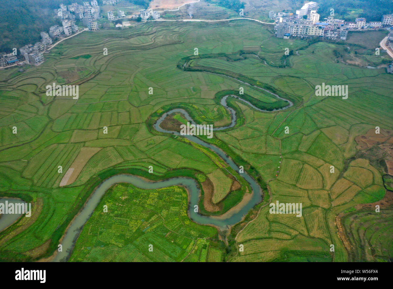 Aerial view of the Ming River, a symbol of Bama, flowing through the ...