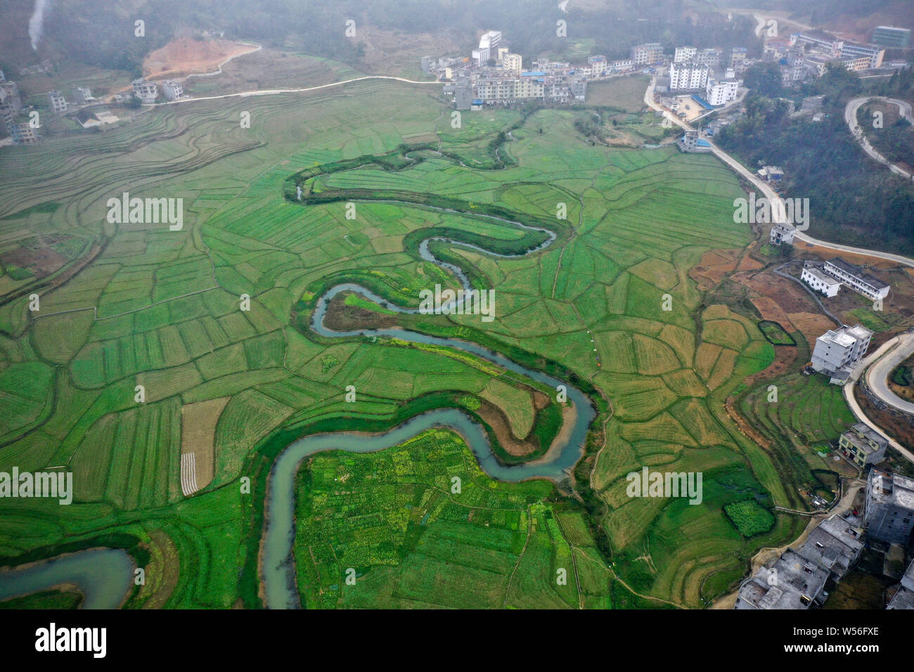 Aerial view of the Ming River, a symbol of Bama, flowing through the ...