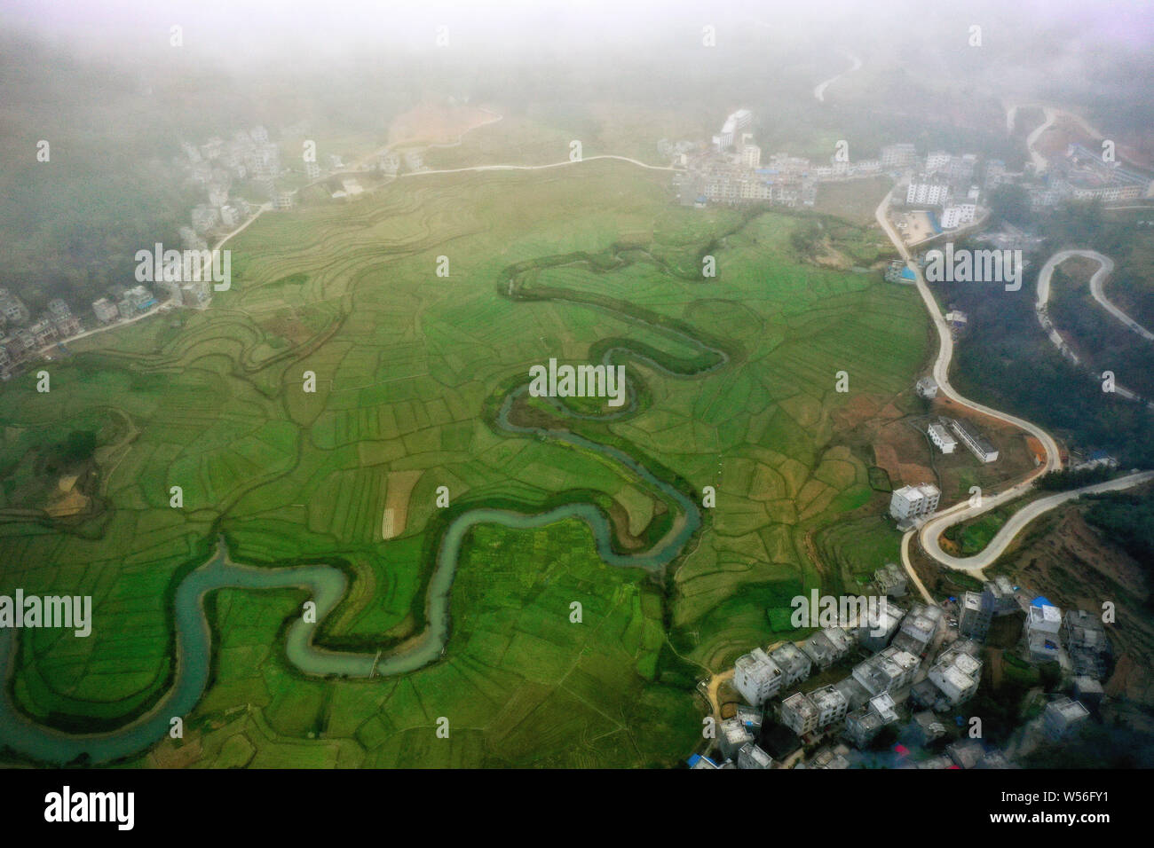 Aerial view of the Ming River, a symbol of Bama, flowing through the ...