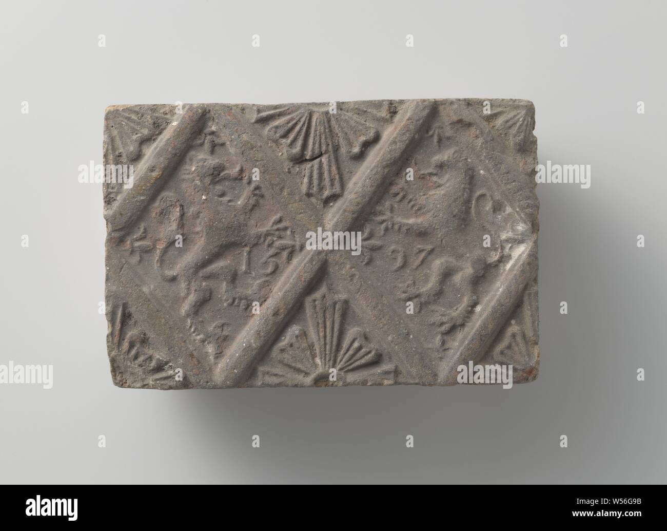 Fireplace made of fired earth with diamond-shaped distribution, with ...