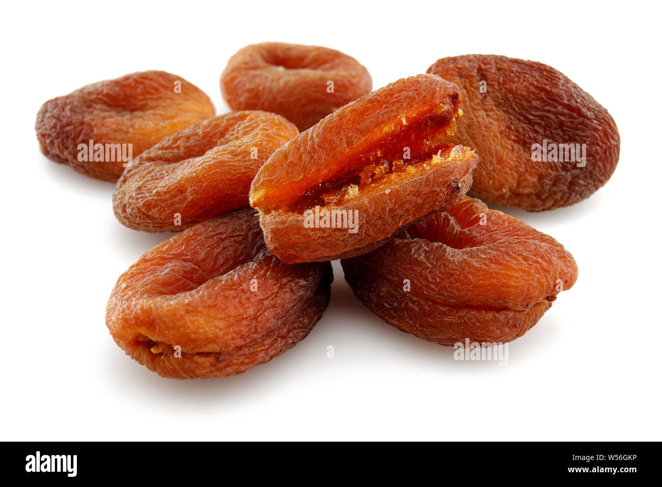 Organic dried apricots isolated on white background Stock Photo - Alamy