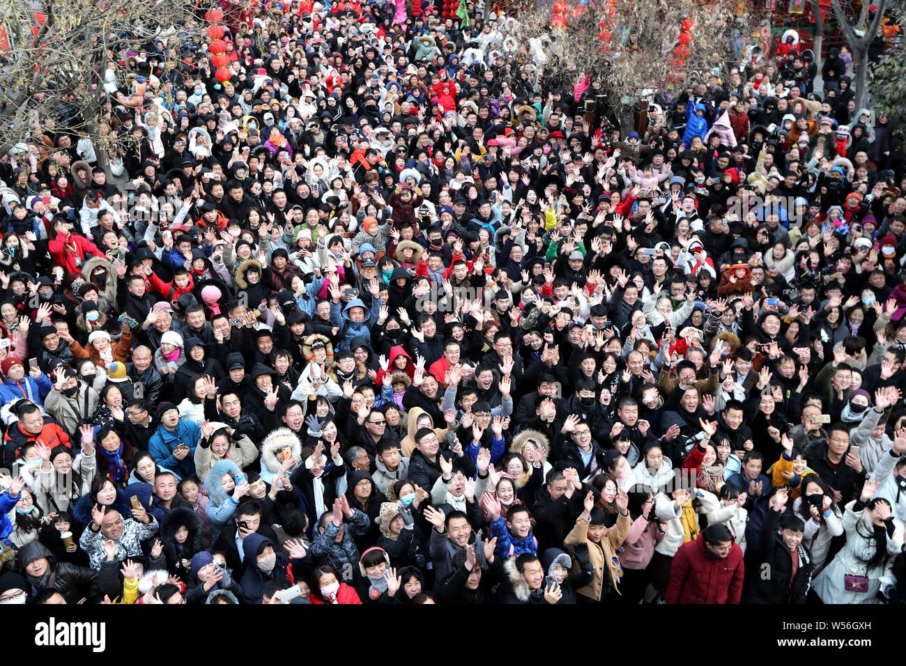 Tourists crowd the Millennium City Park to get red pocket money from ...