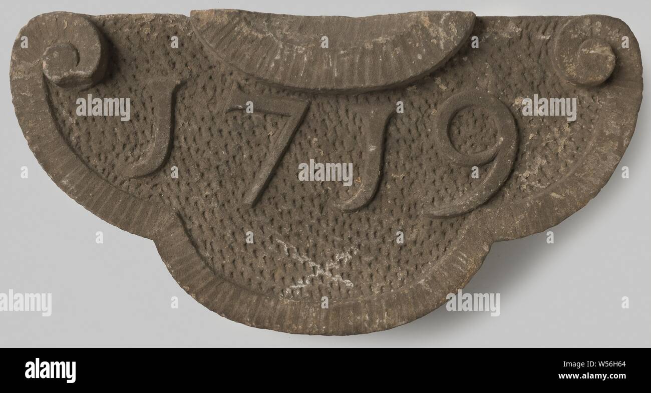 facing brick with year 1719, Semi-circular cartouche with a scaled ...