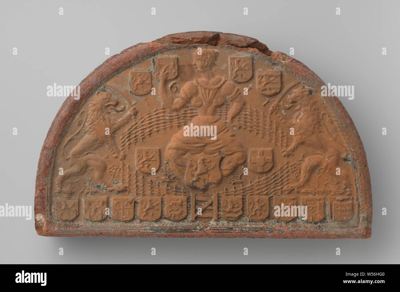 Fireplace capstone representation of the Dutch virgin and the weapons ...