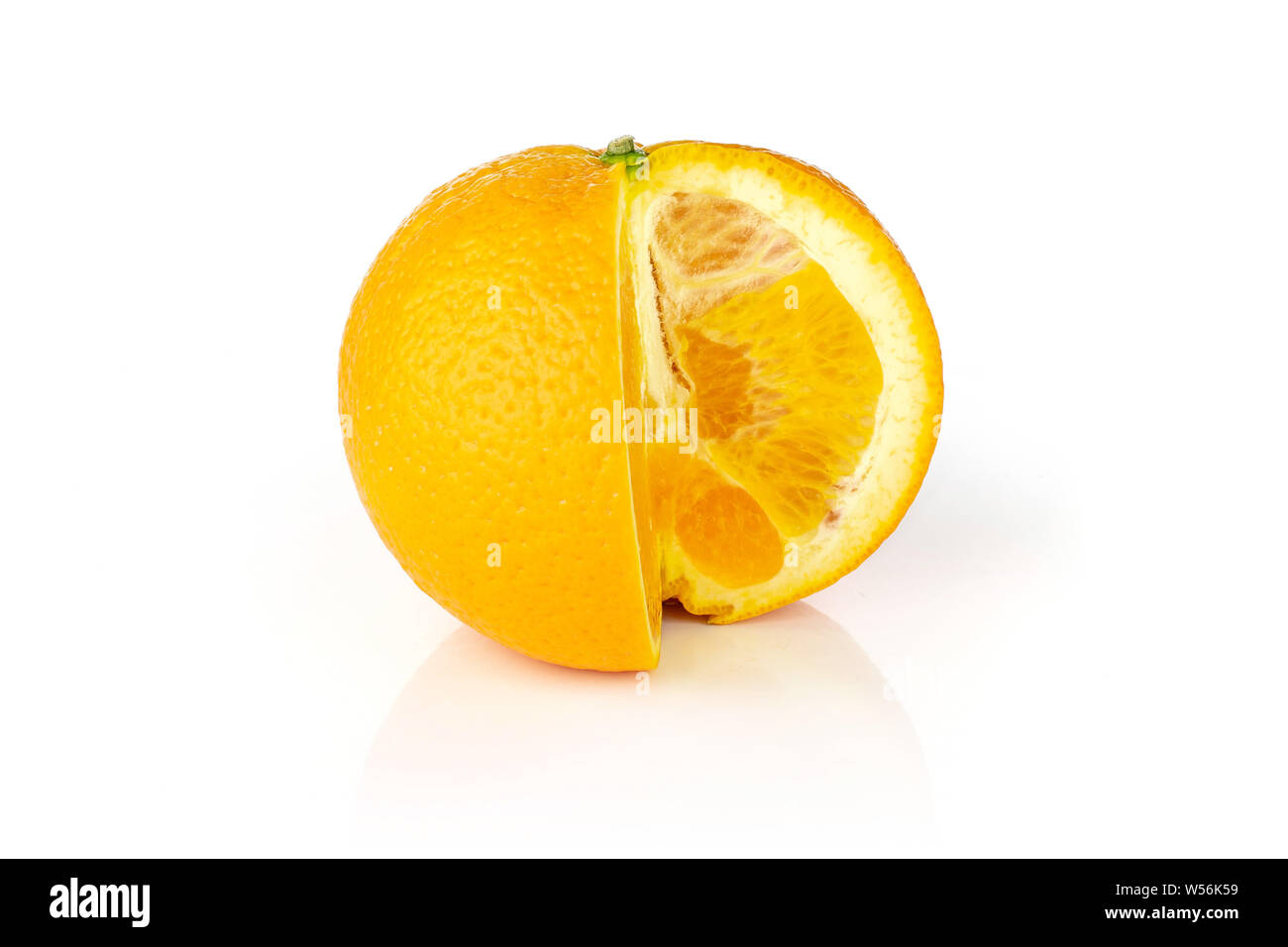 One whole fresh sweet orange with a quarter cutted out on the side ...