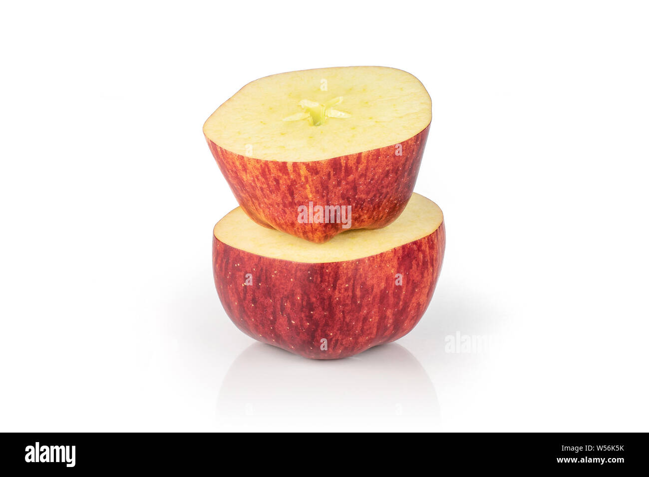 Group of two halves of fresh apple red delicious one half is sitting on ...
