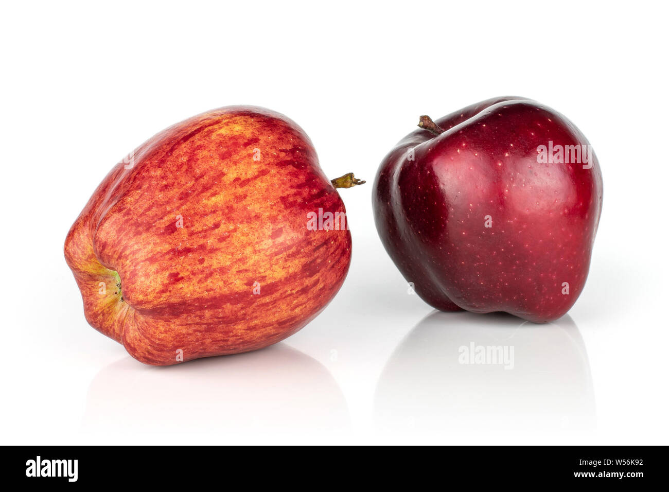 Group of two whole fresh apple red delicious one light and one dark ...