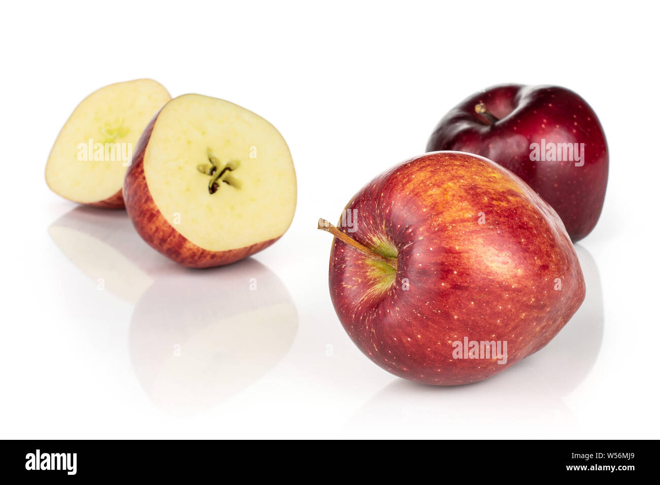 Group of two whole two halves of fresh apple red delicious isolated on ...