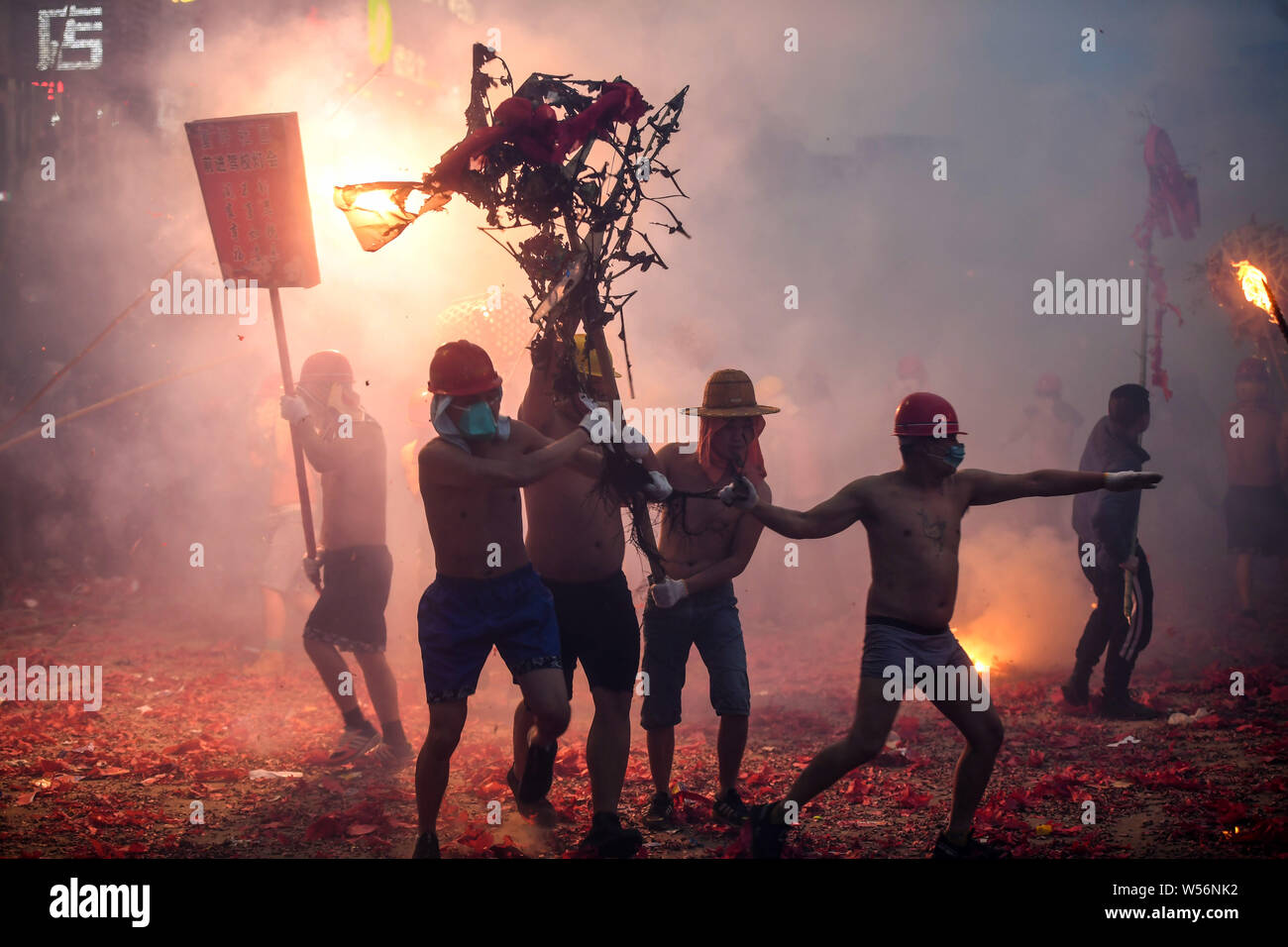 Local Chinese people conduct firecracker dragon performance to ...
