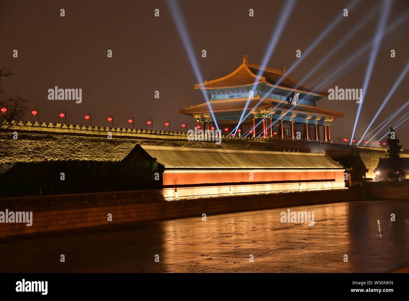 The Palace Museum, also known as the Forbidden City, is illuminated by colorful lights during a ...