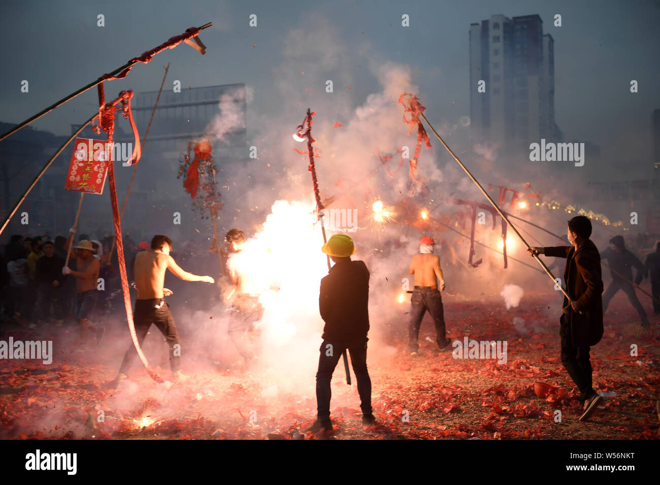 Local Chinese people conduct firecracker dragon performance to ...