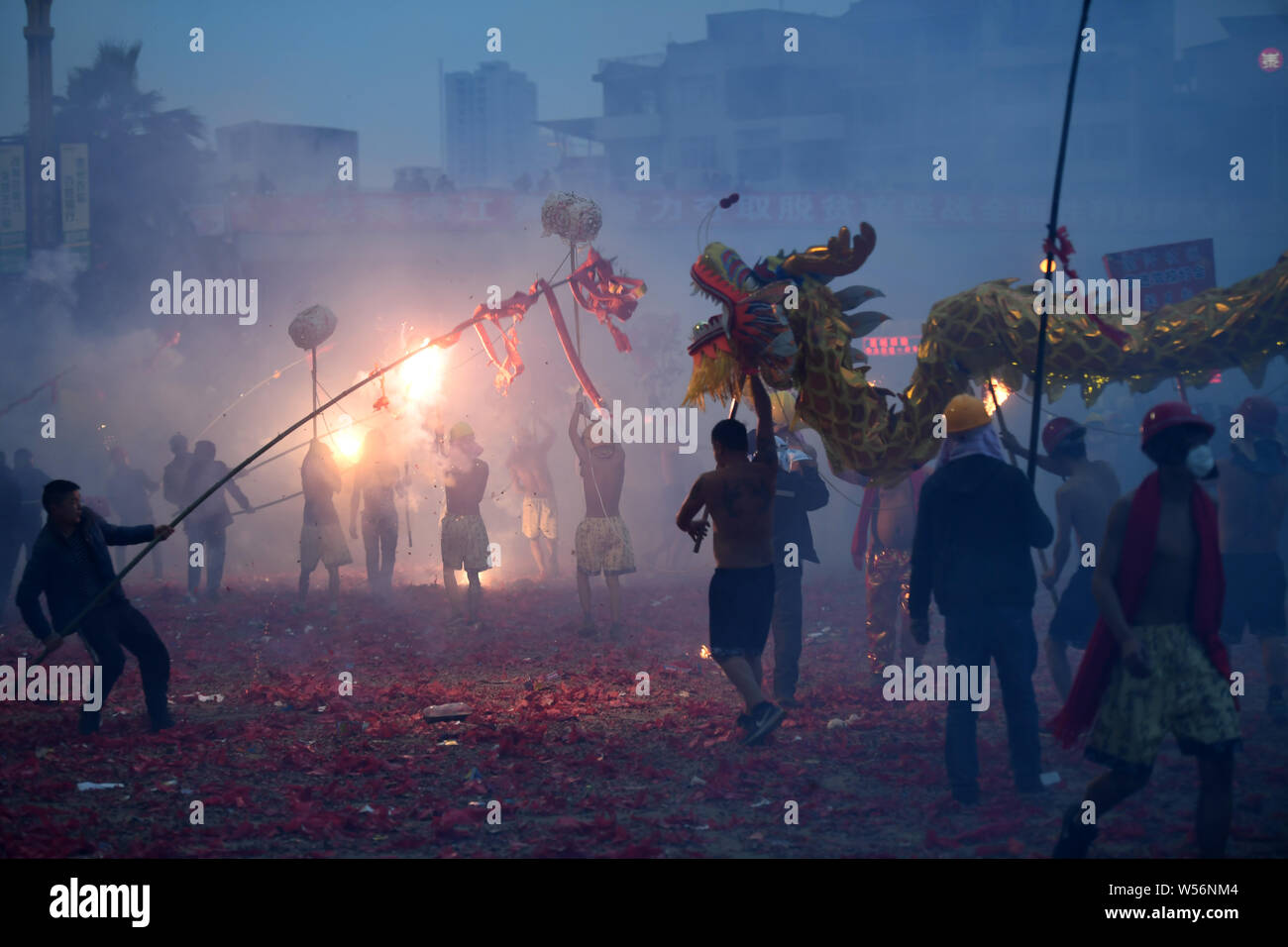 Local Chinese people conduct firecracker dragon performance to ...