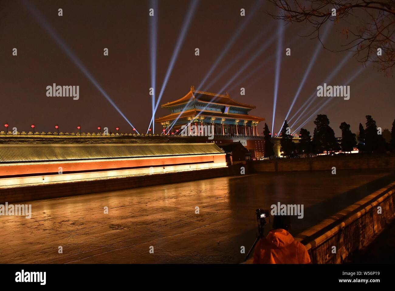 The Palace Museum, also known as the Forbidden City, is illuminated by colorful lights during a ...