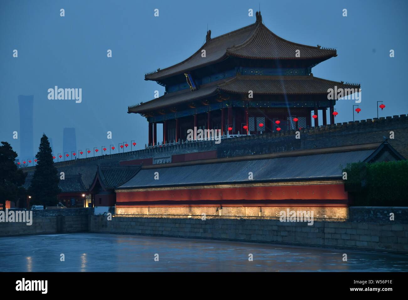 The Palace Museum, also known as the Forbidden City, is illuminated by colorful lights during a ...