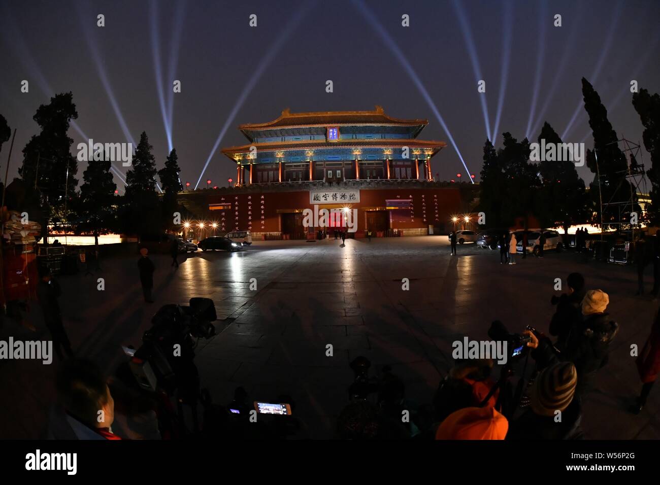 The Palace Museum, also known as the Forbidden City, is illuminated by colorful lights during a ...