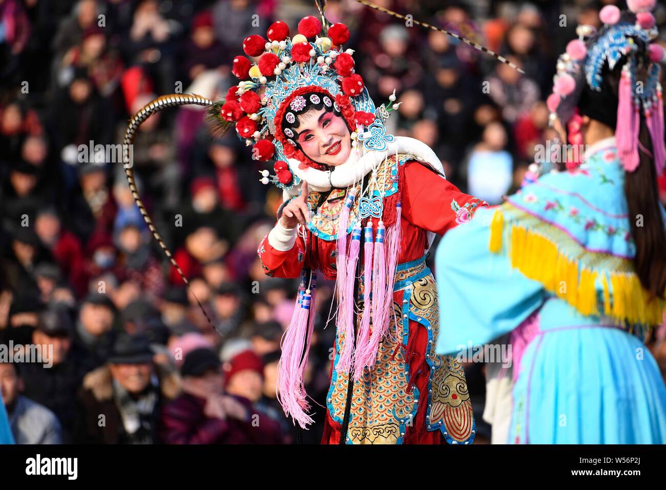 Actors perform Bangju opera at Weiwu plaza in Bozhou city, east China's ...