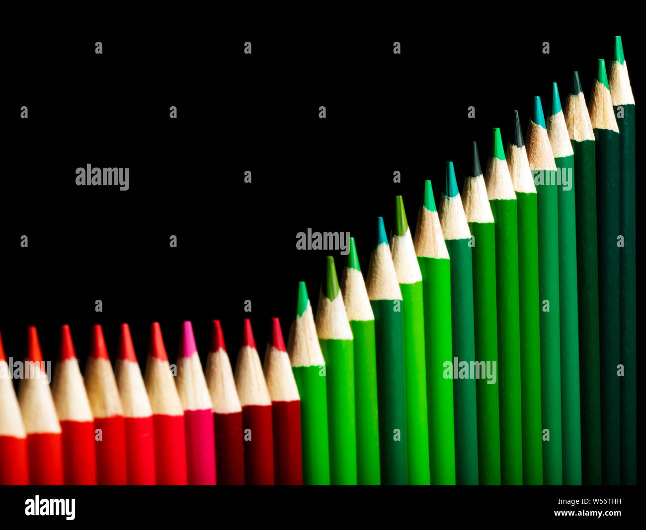 Colored red & green pencils representing business graph of increasing ...