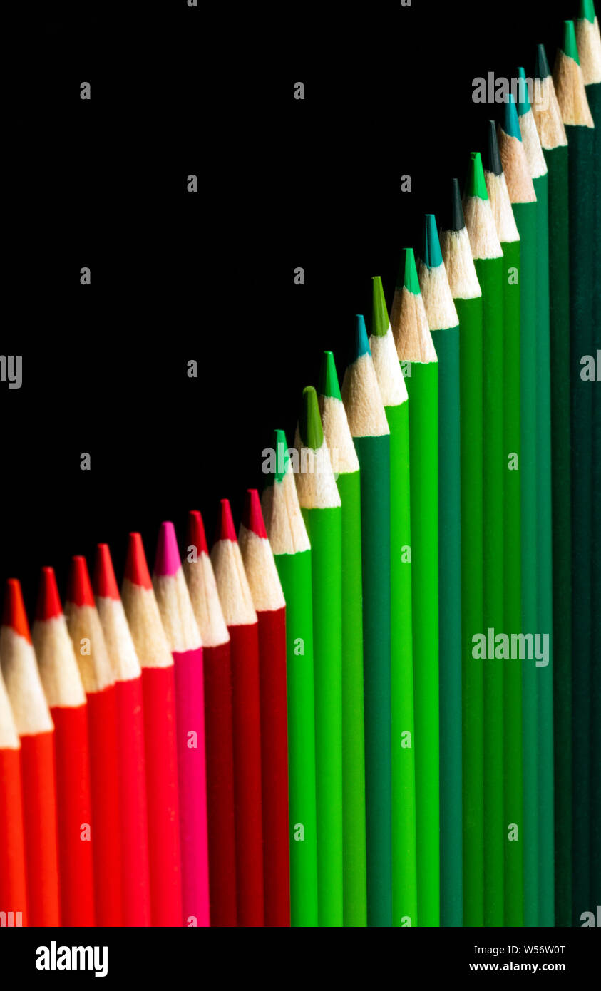 Colored red & green pencils representing business graph of increasing ...