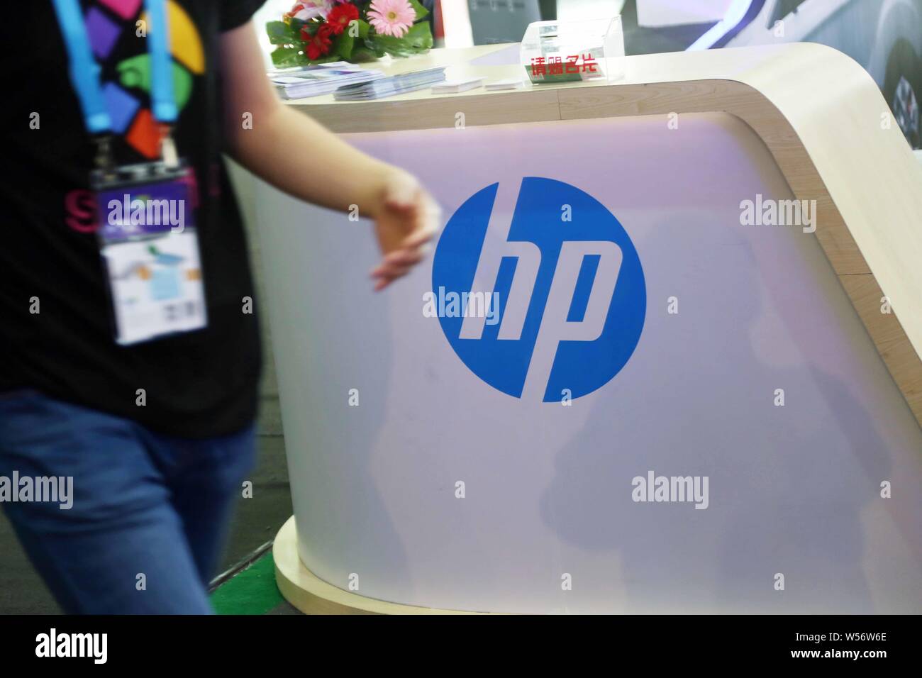 --FILE--People visit the stand of HP (Hewlett Packard) during an expo ...