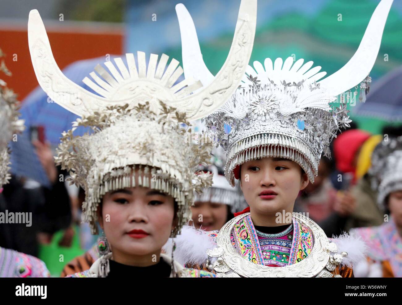 A Chinese girl of Miao ethnic group dressed in the traditional silver ...