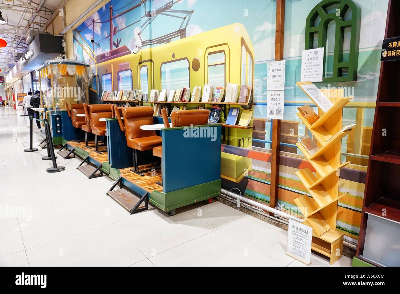 Books are placed on the bookshelf in a mini-bookstore at a supermarket ...