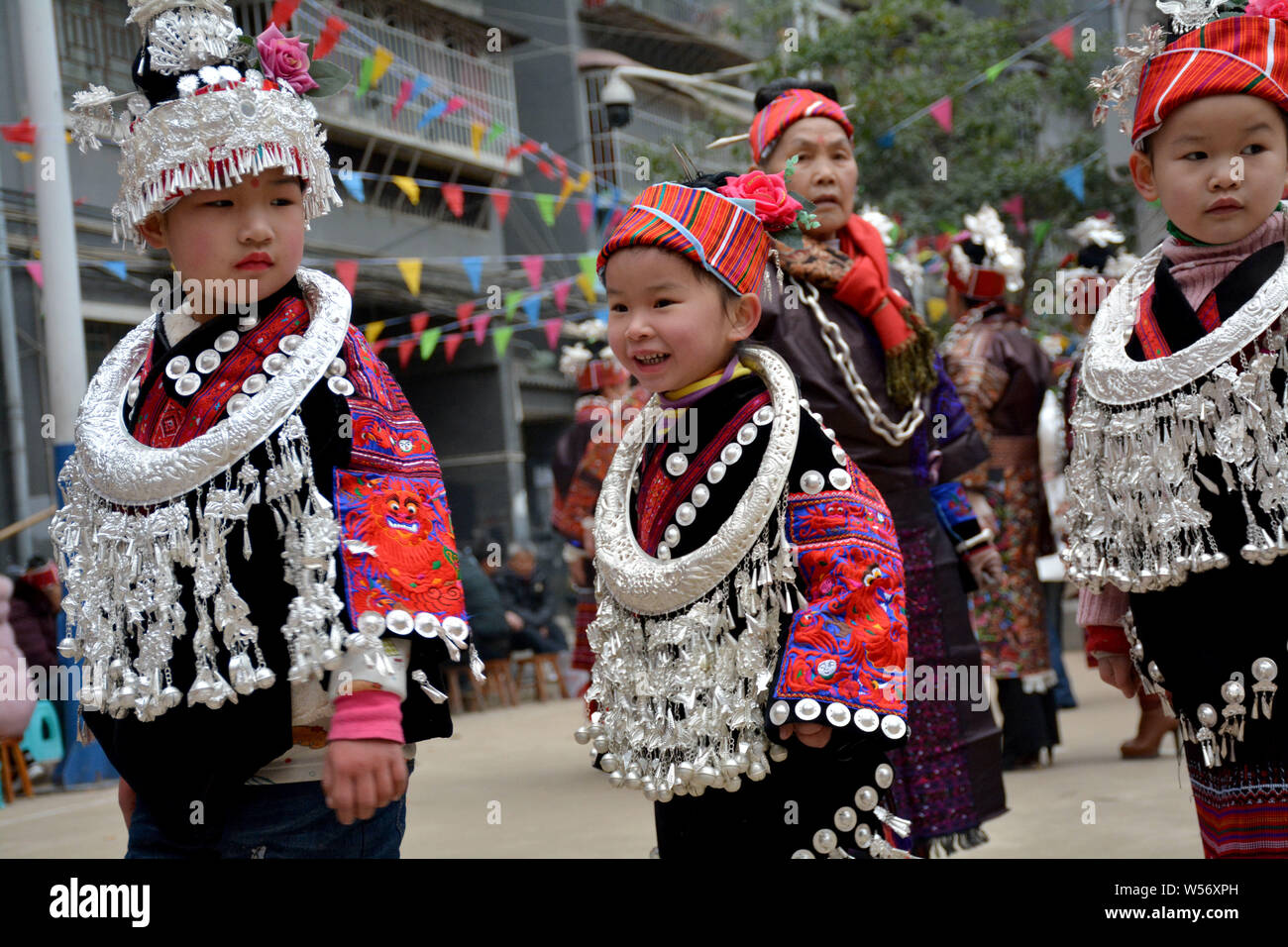 Chinese people of Miao ethnic group dressed in traditional costumes and ...