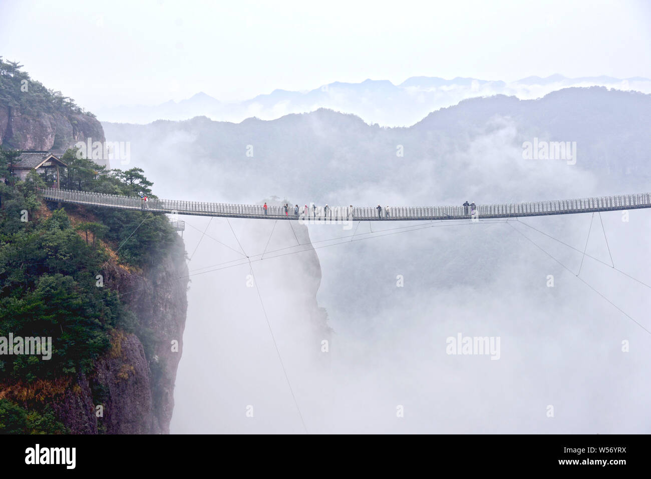A view of seas of clouds floating through the Xianju National Park ...