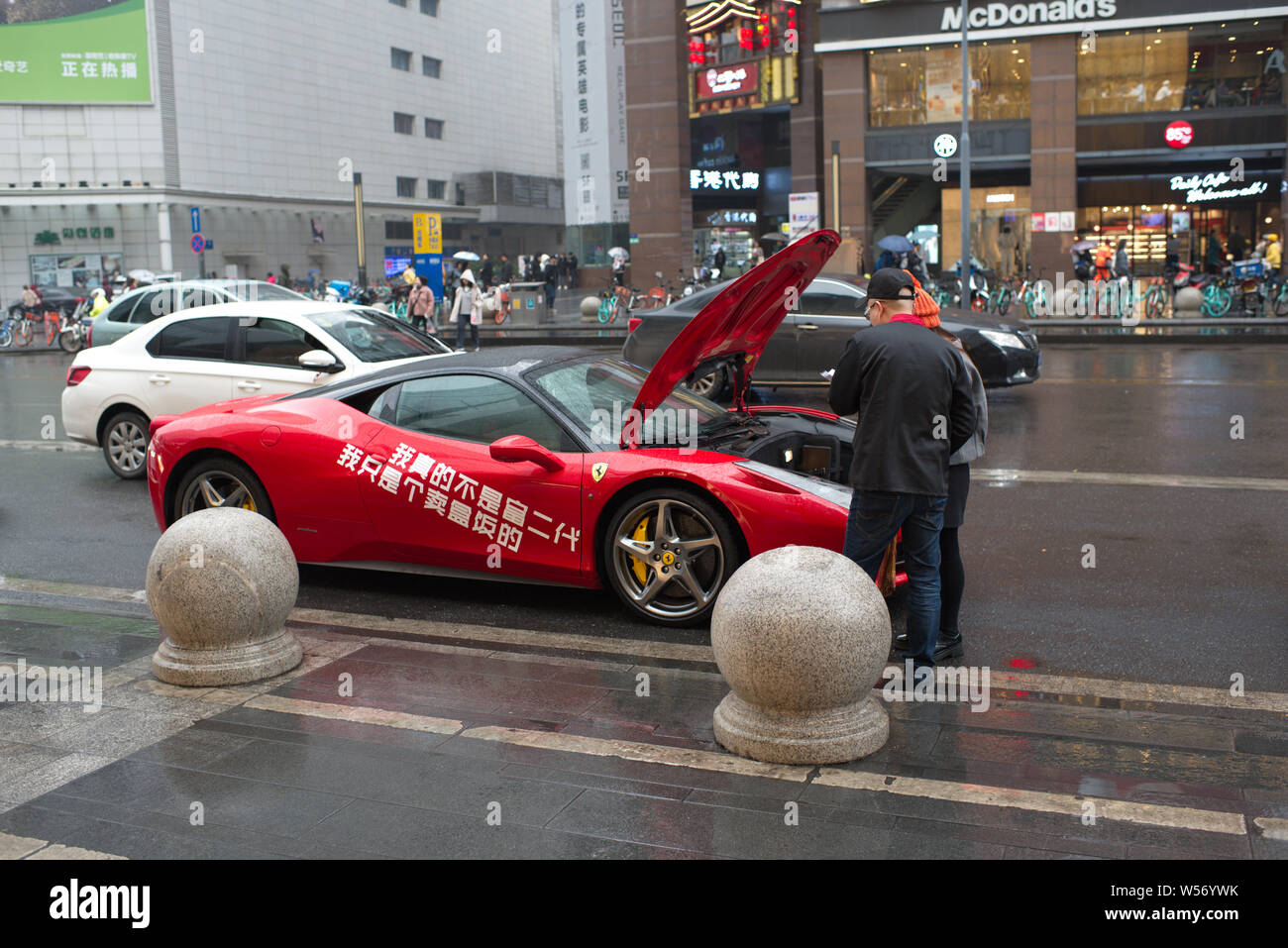 A food store owner drives a luxury Ferrari sports car to deliver meals ...
