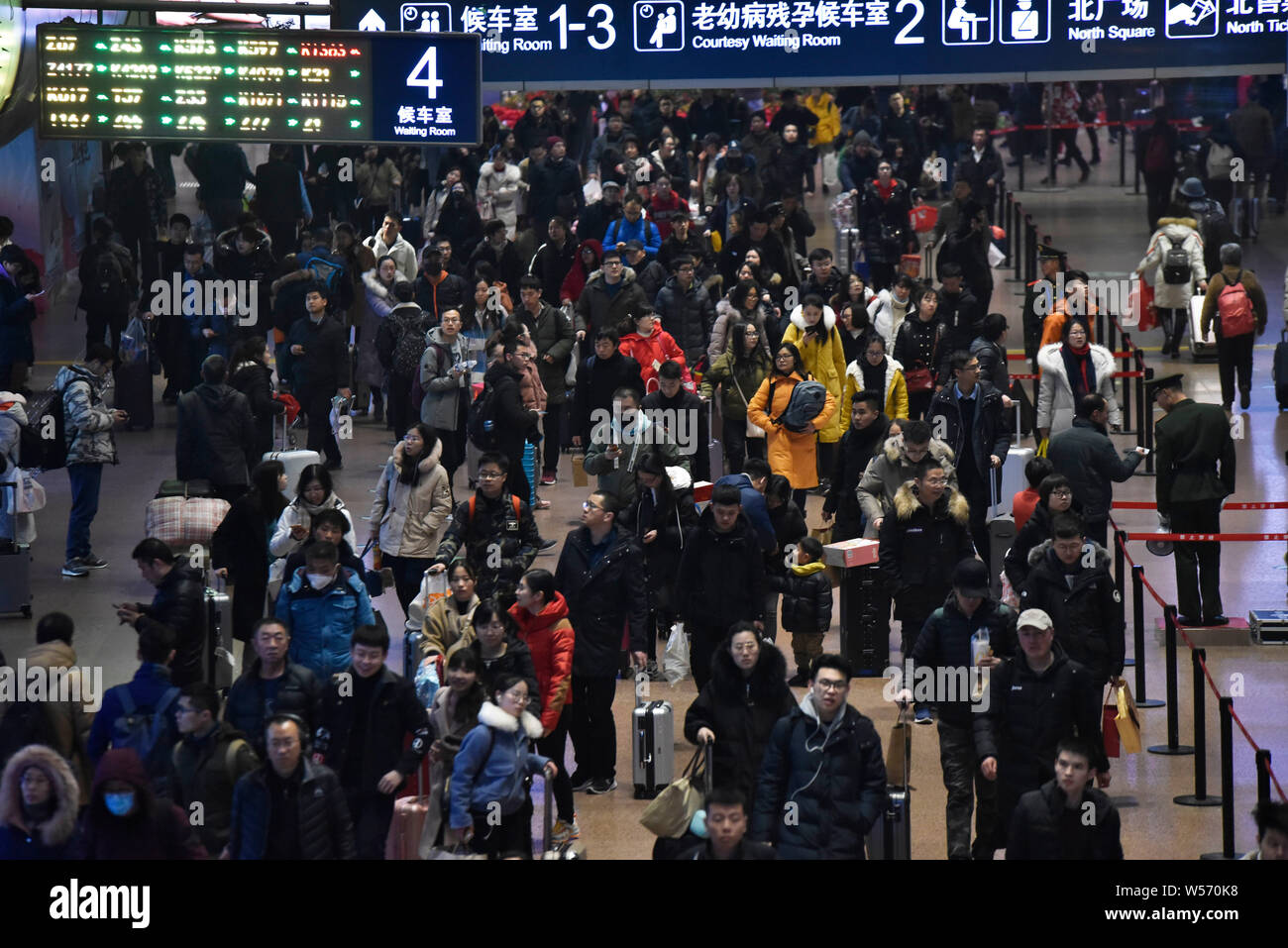 Passengers wait for their trains during the Spring Festival travel rush ...